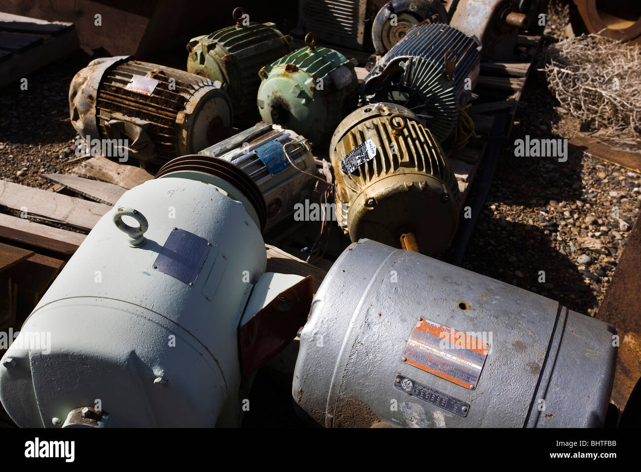 Used small motors at junk yard Stock Photo - Alamy