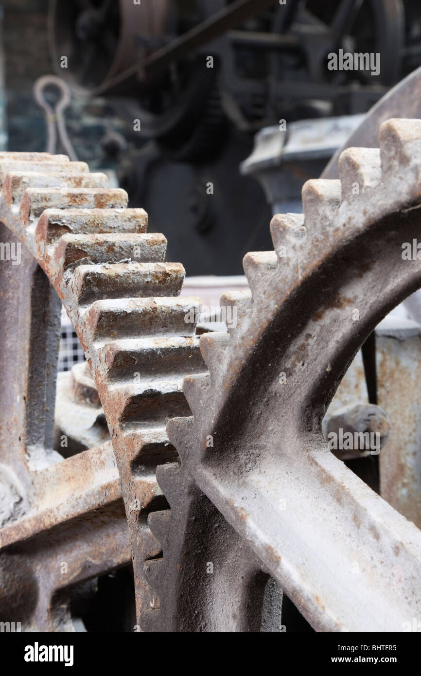 Industrial cog wheels interlocking Stock Photo - Alamy