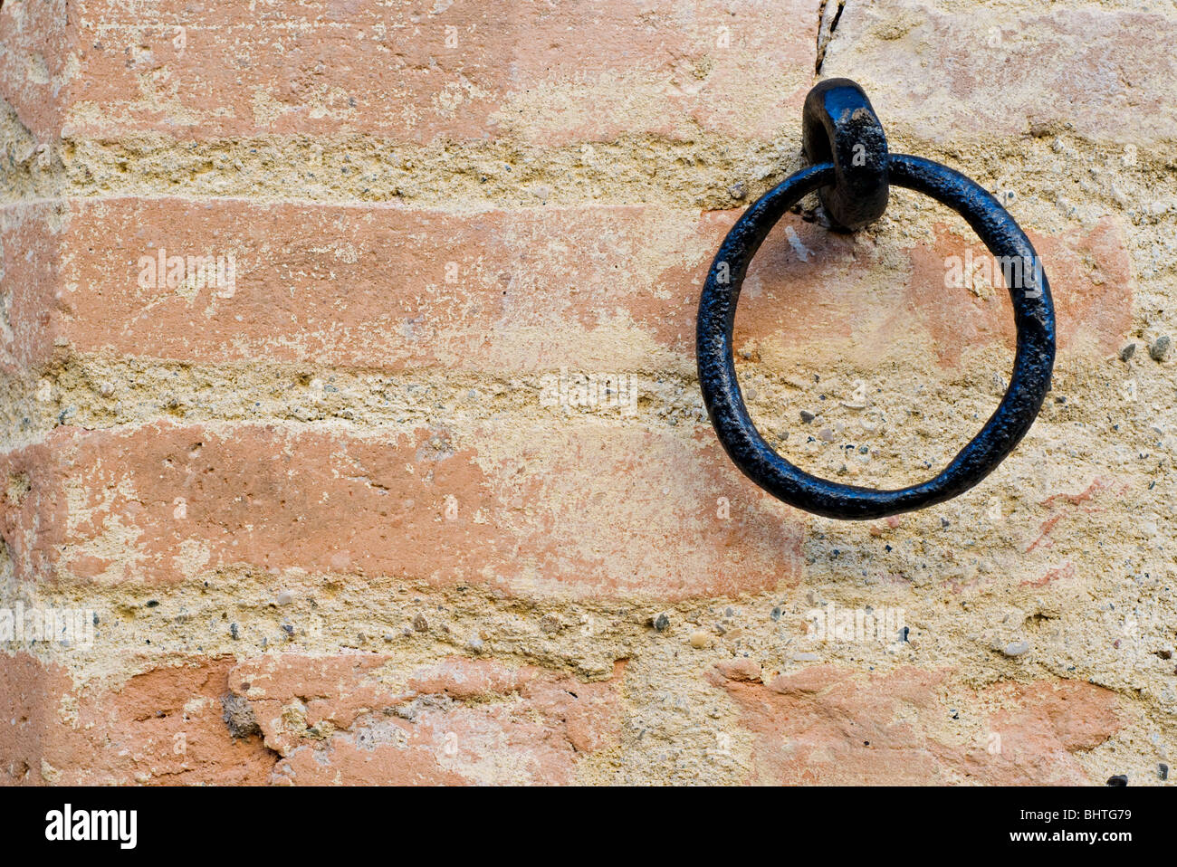Hanging hardware/ ring on a brick wall Stock Photo - Alamy