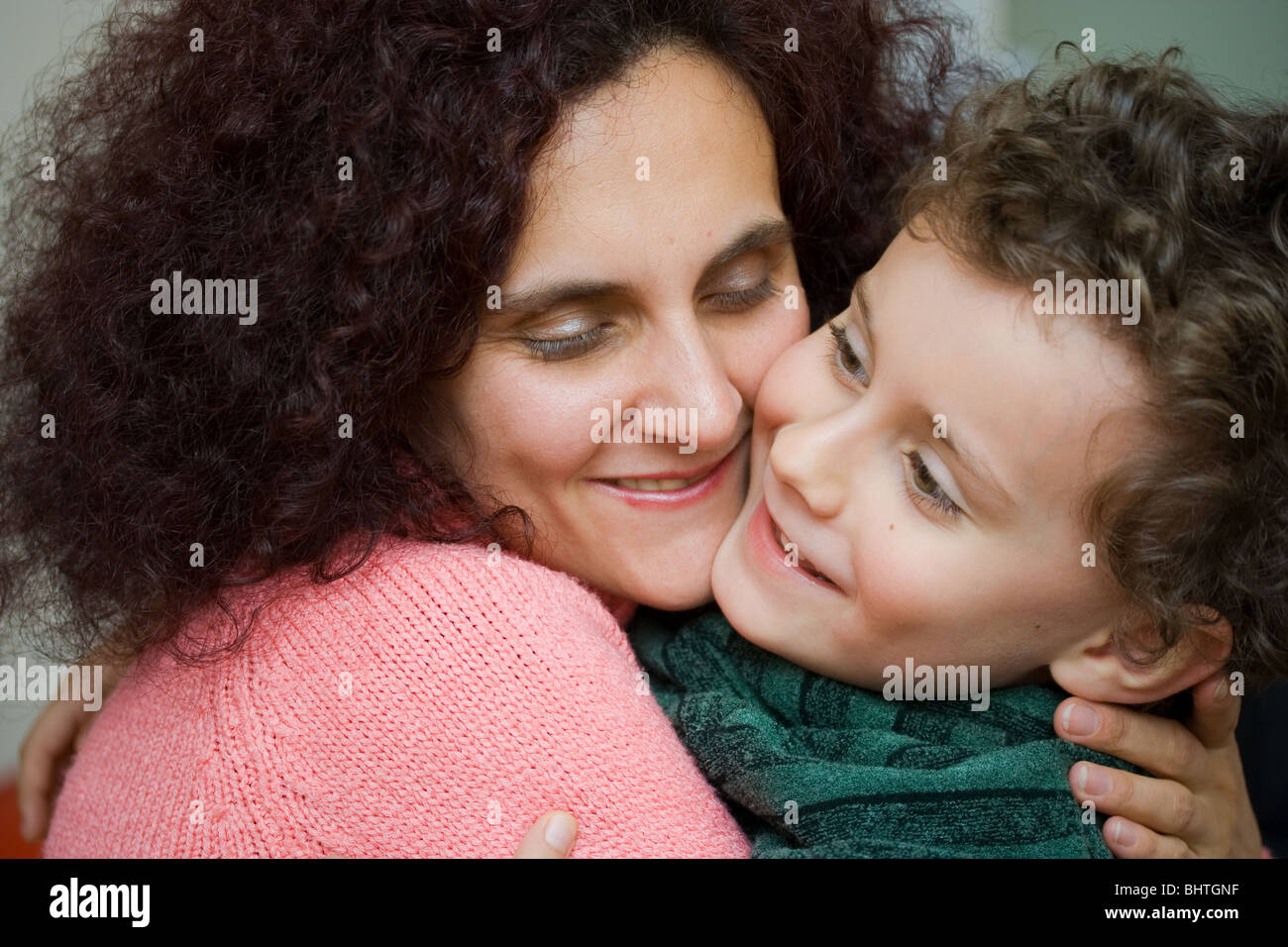 Mother and son embracing each other. Indoor scene Stock Photo - Alamy