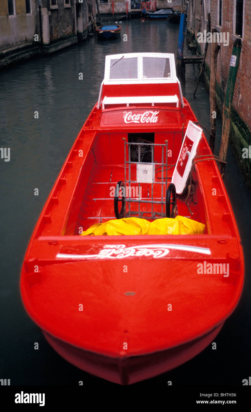 Red Coca-Cola barge moored in canal, Venice, Italy Stock Photo - Alamy