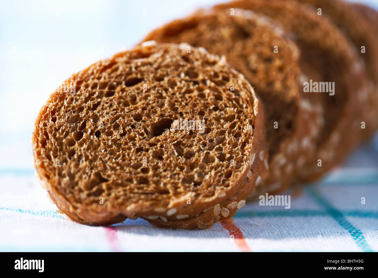 Closeup photo of slices of rye bun with sesame Stock Photo - Alamy