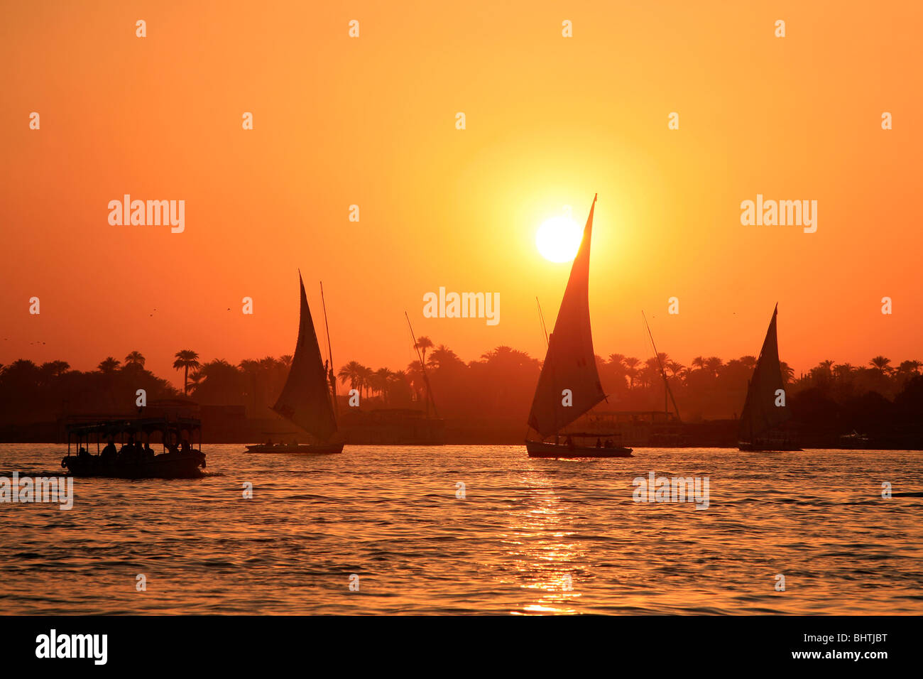 Various feluccas at sunset in Luxor, Egypt Stock Photo - Alamy