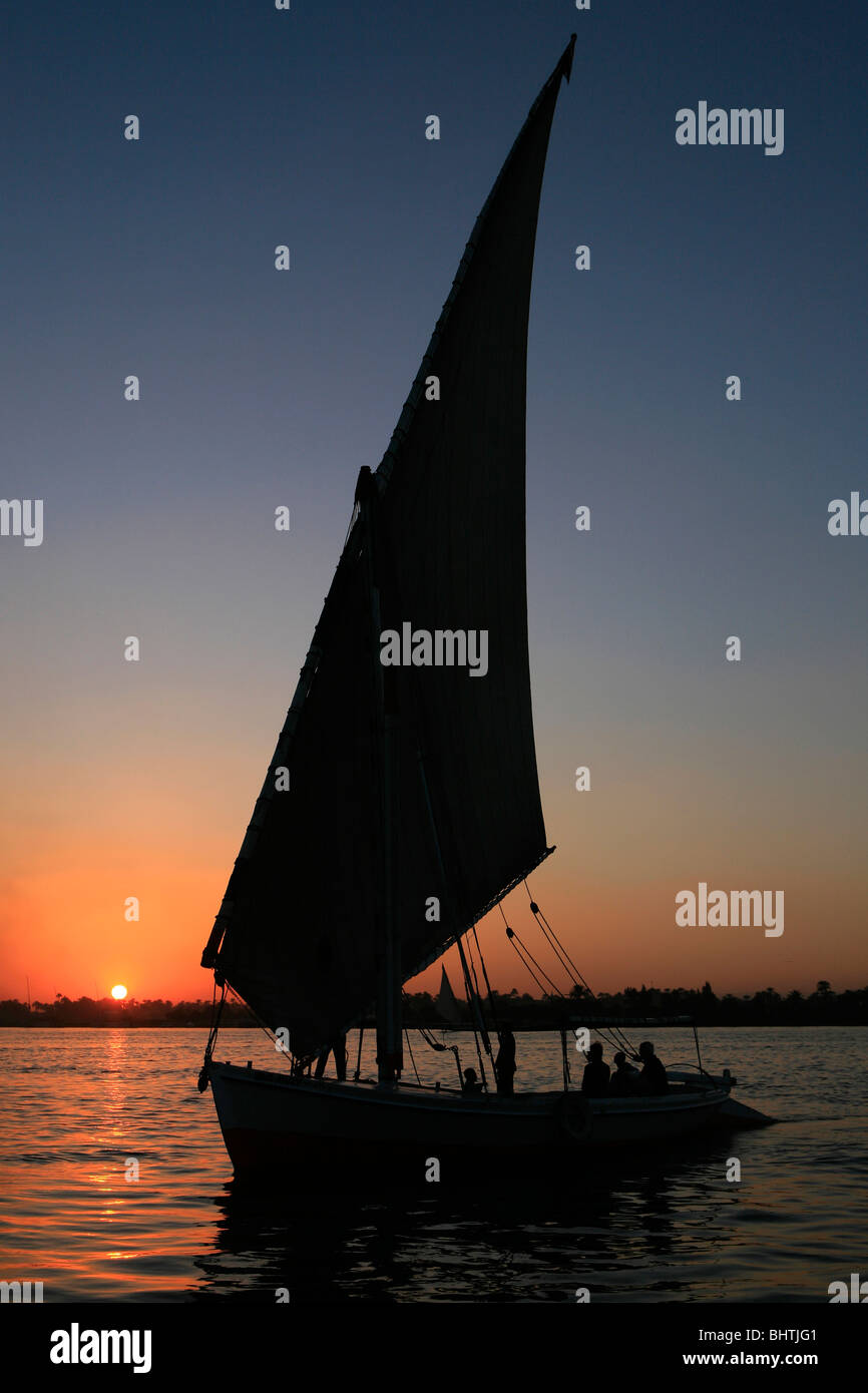 Felucca at sunset in Luxor, Egypt Stock Photo - Alamy