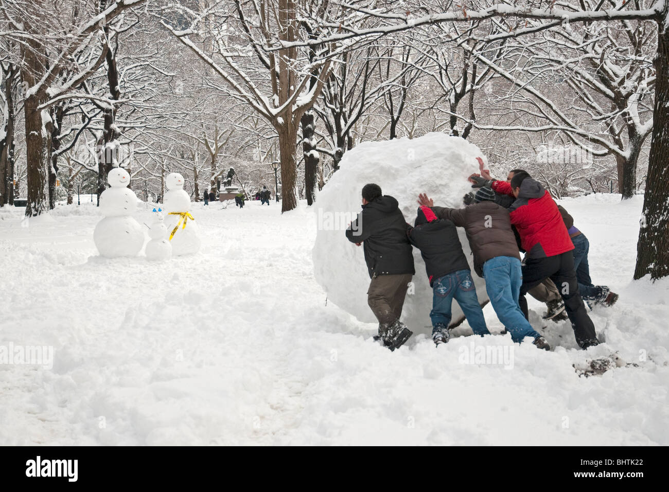 People Building a Snowman in Central Park after a snowstorm Stock Photo ...