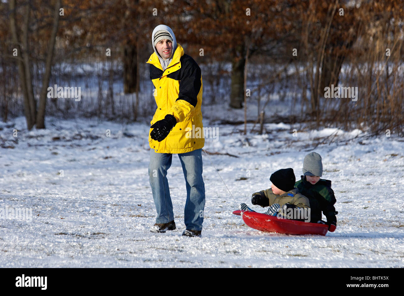 Boys pulling sled hi-res stock photography and images - Alamy