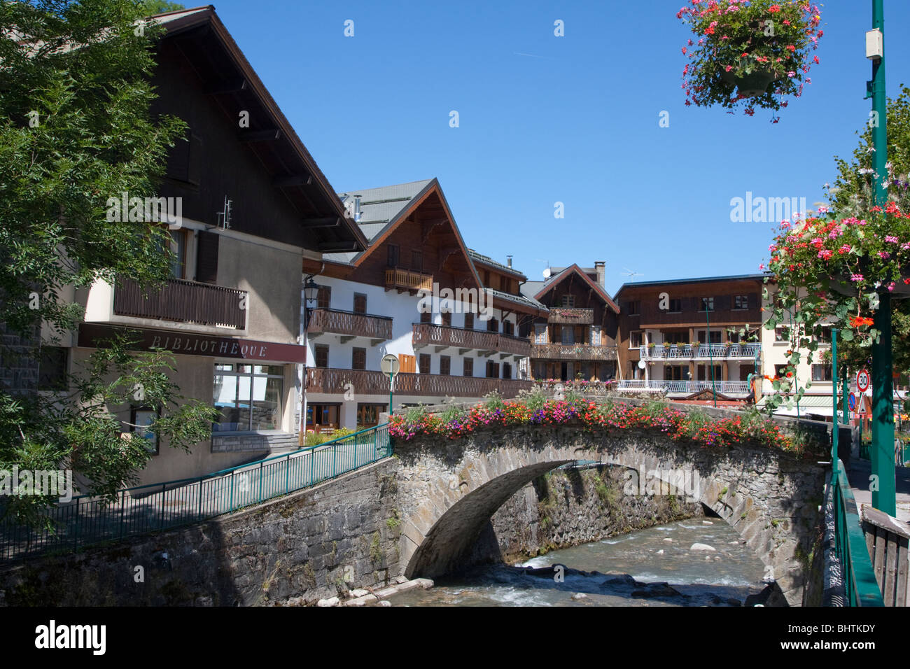 Bridge over the river Dranse in Morzine summer Stock Photo - Alamy
