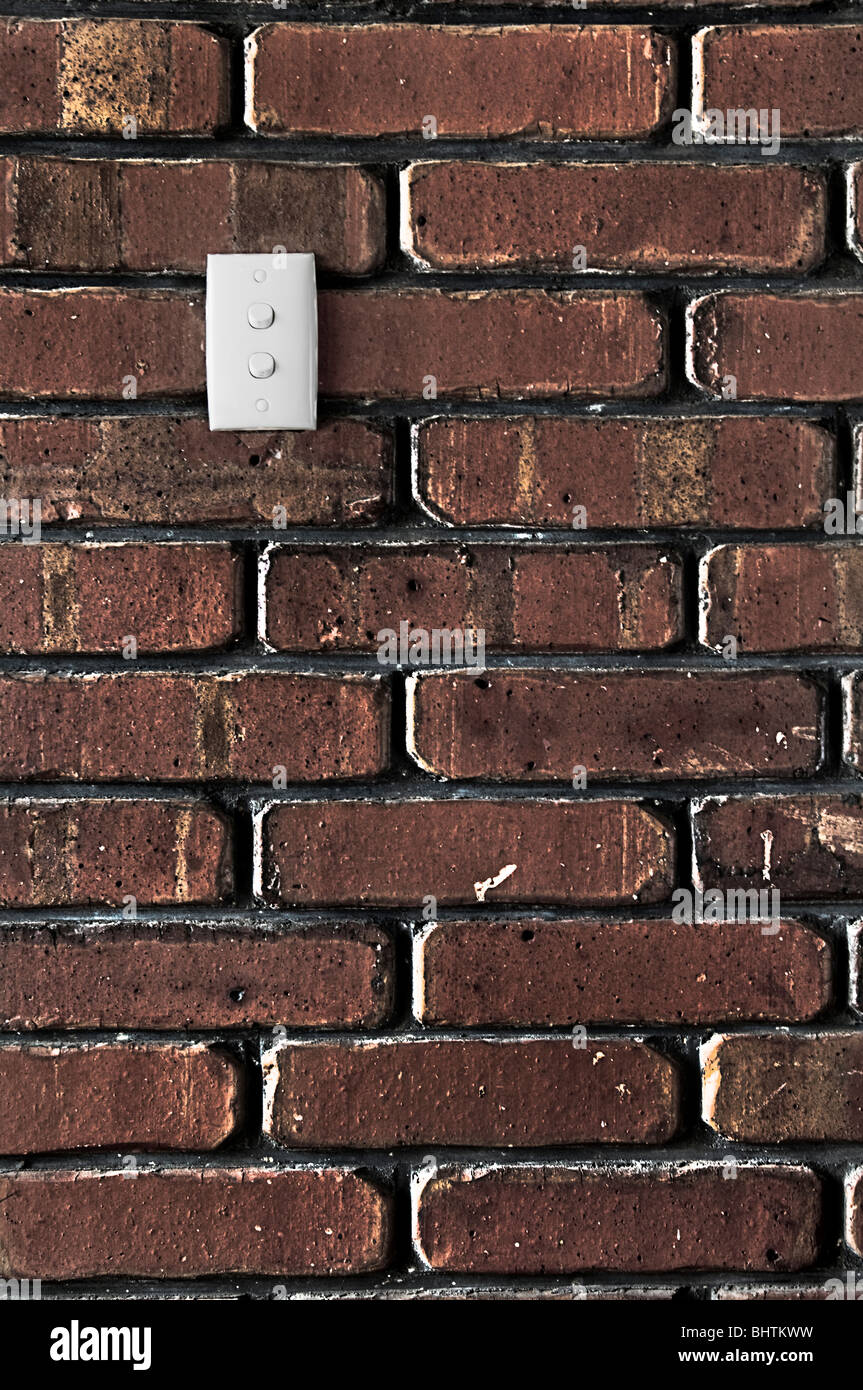 Grunge styled brick wall showing lots of texture with a double light ...