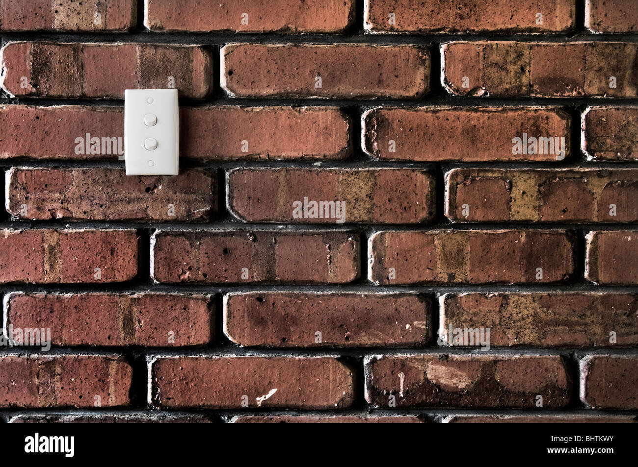 Grunge styled brick wall showing lots of texture with a double light ...