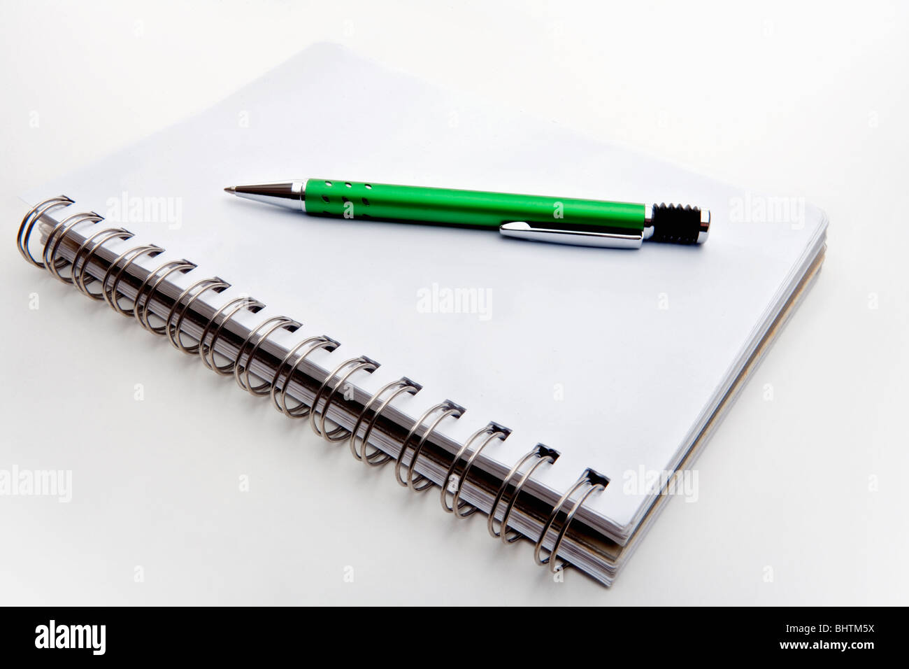ballpoint pen and spiral notebook isolated on white Stock Photo - Alamy