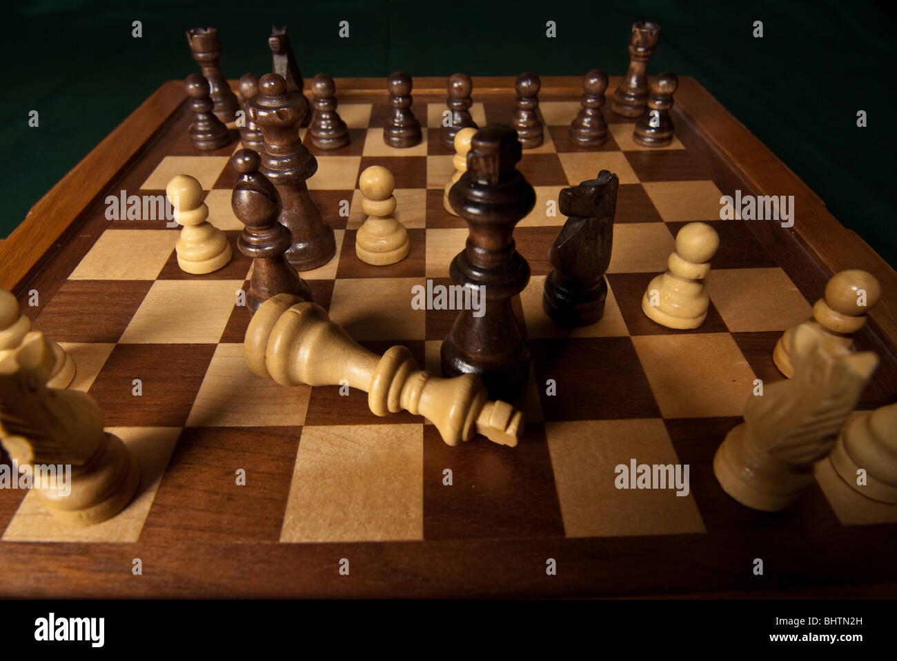 Fallen white chess pieces Stock Photo - Alamy