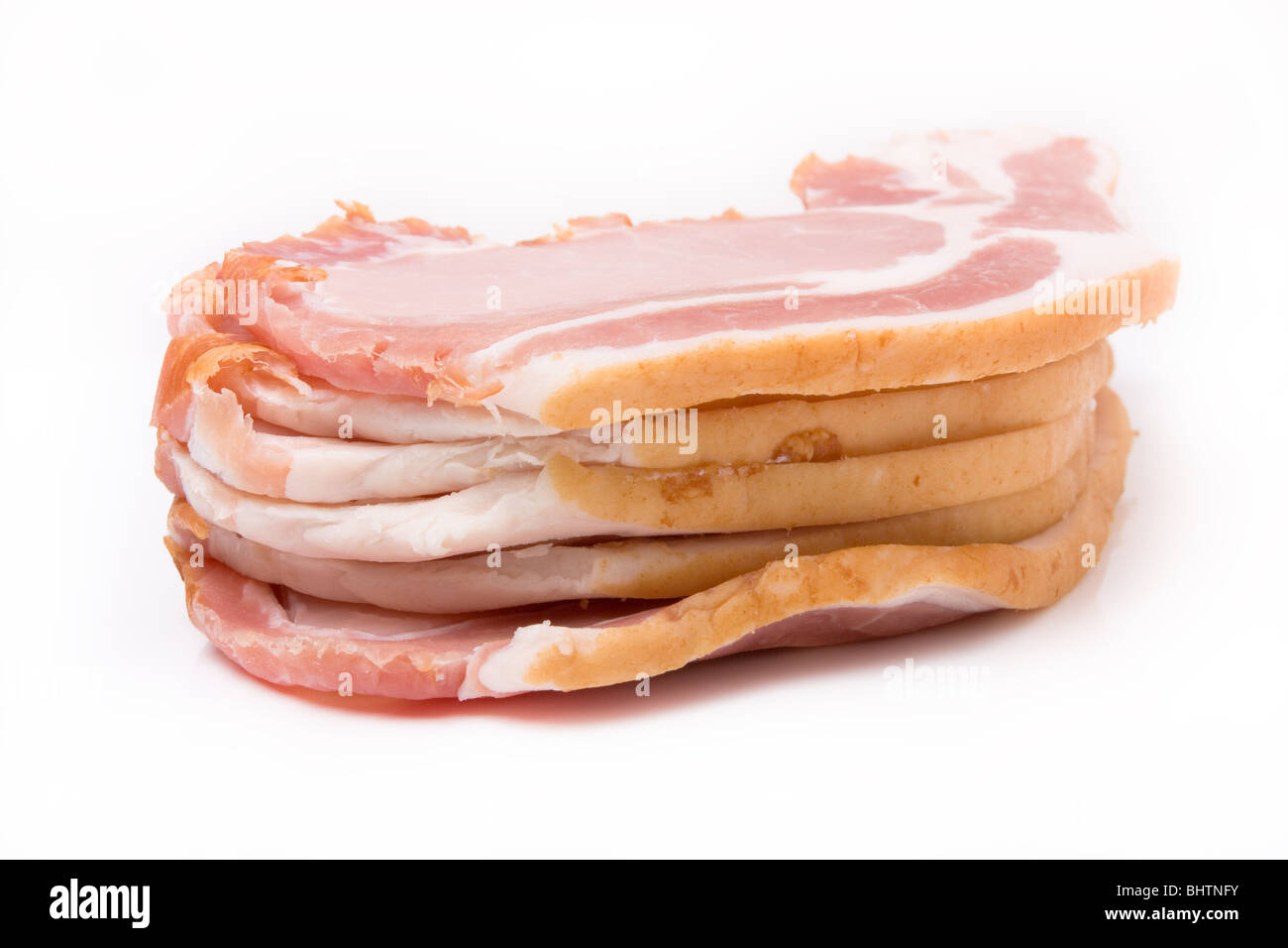 Pile of raw uncooked Sliced bacon isolated against white background ...