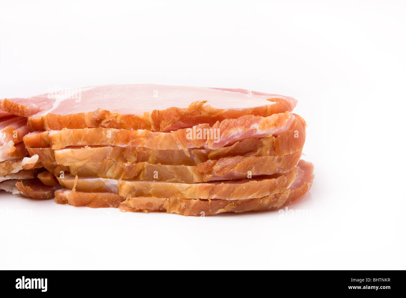 Pile of raw uncooked Sliced bacon isolated against white background ...