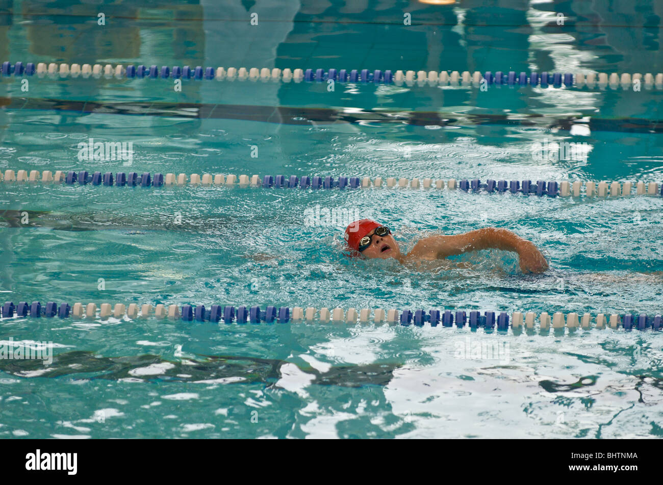 A young boy swimming freestyle in a swimming competiton Stock Photo - Alamy