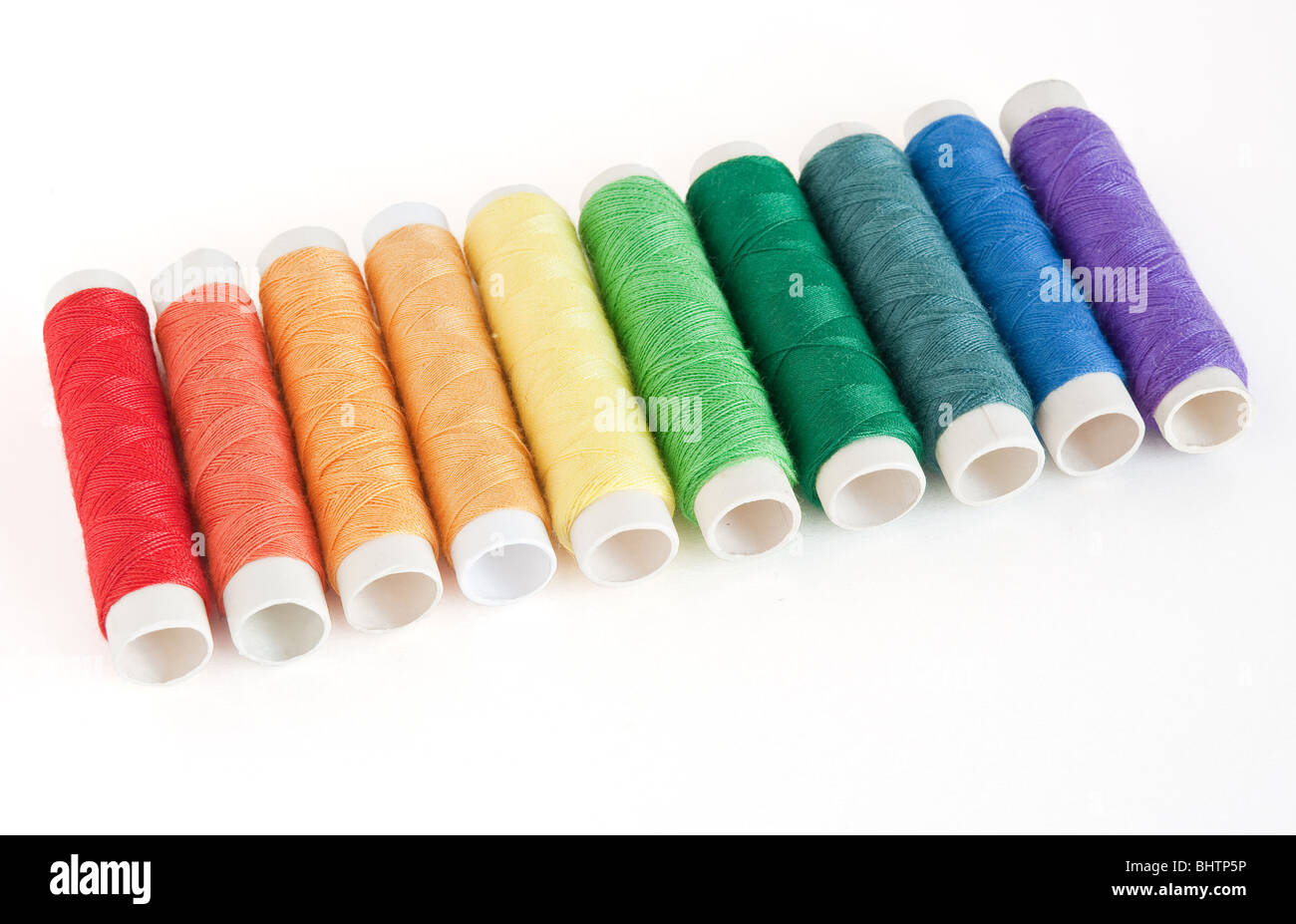 rainbow color spools threads isolated on white background Stock Photo ...