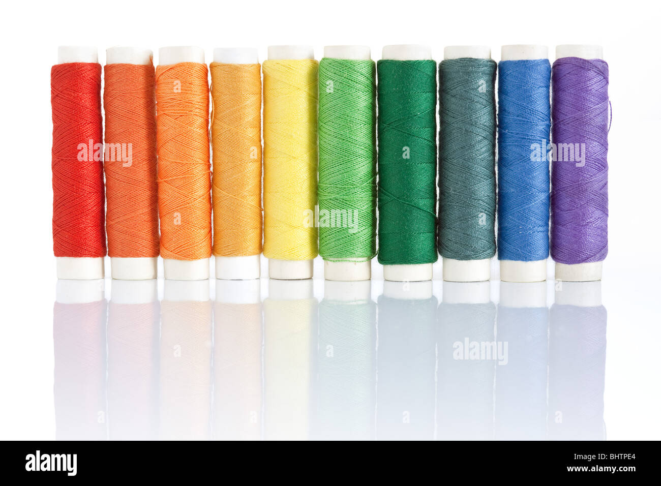 rainbow color spools threads isolated on white background Stock Photo ...