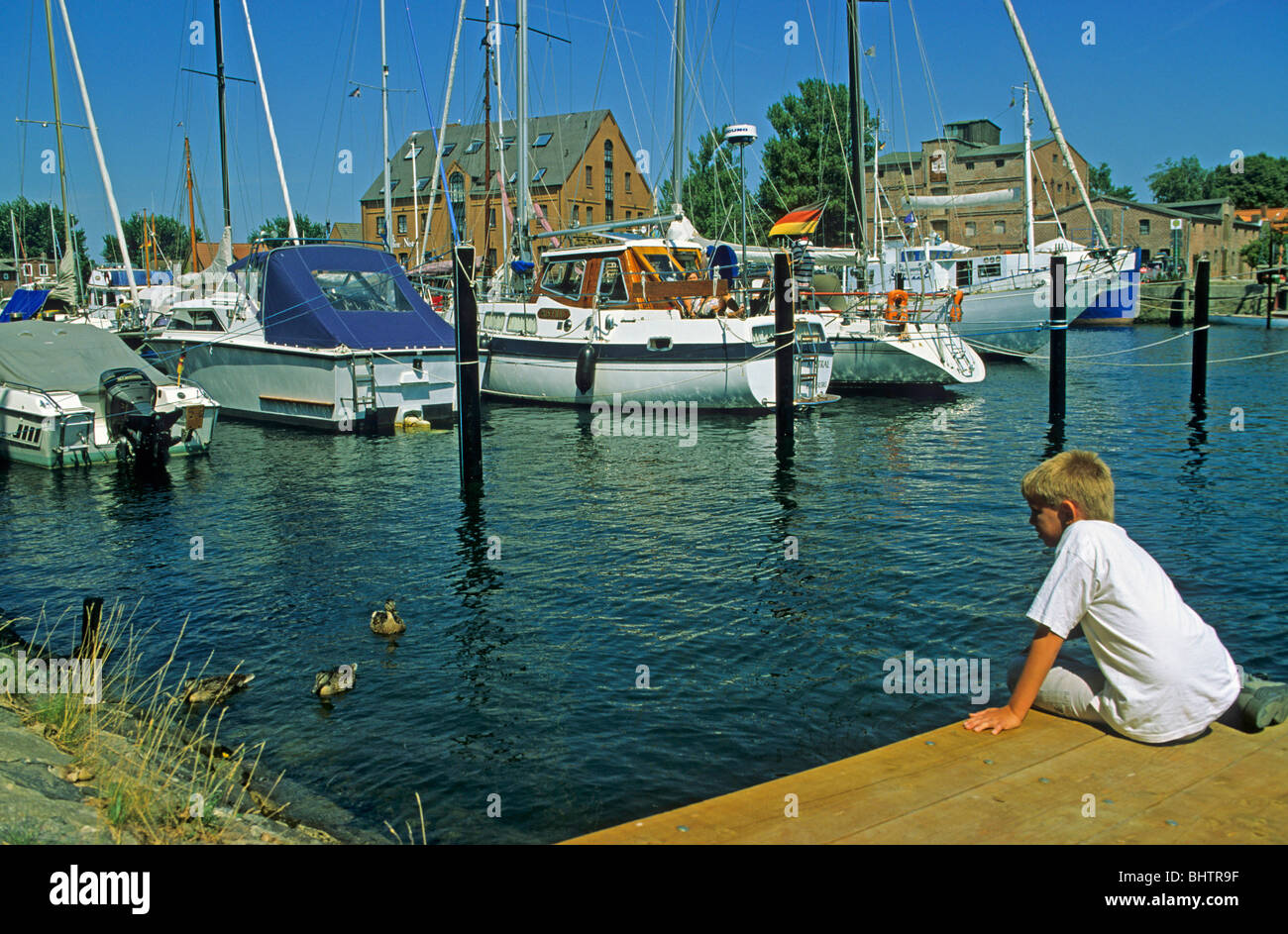 Boy child harbour orth marina hi-res stock photography and images - Alamy