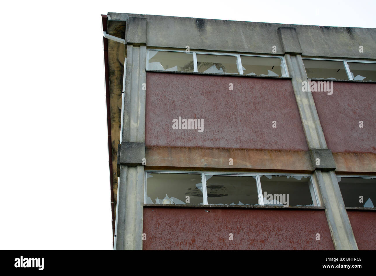 Abandoned building with broken windows Stock Photo - Alamy