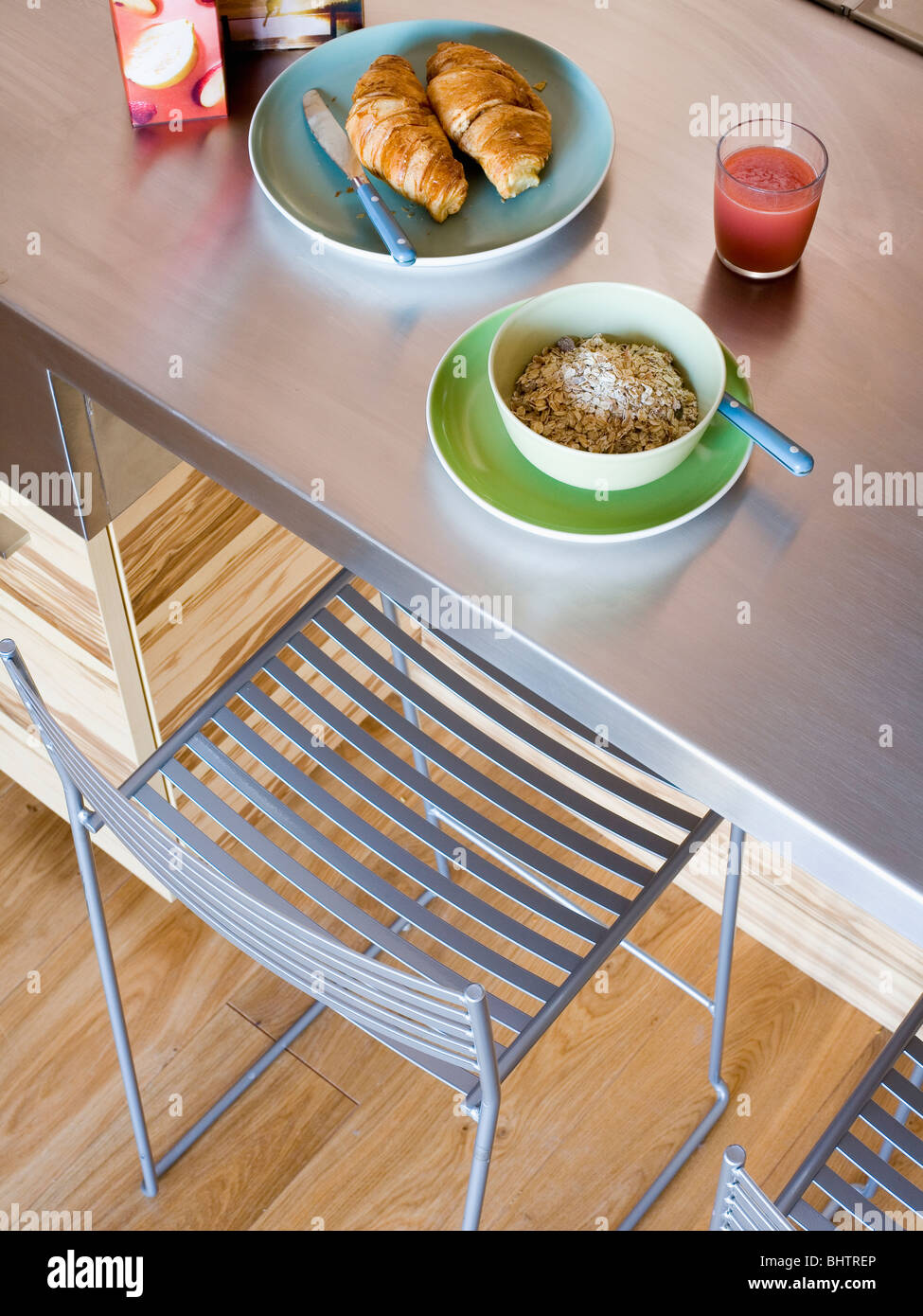 Birdseye view of metal chair and metal table set for breakfast with ...