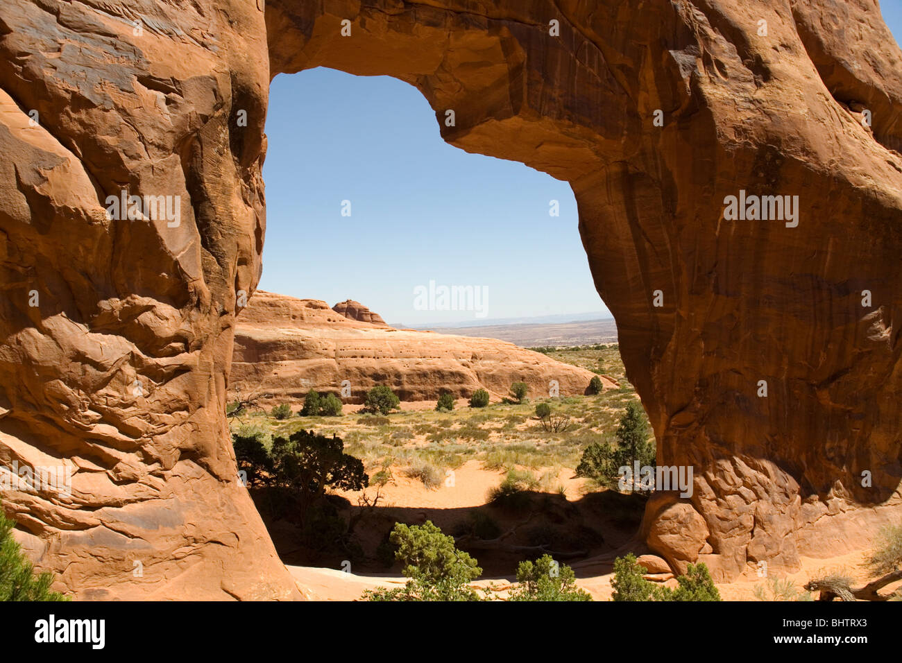 A view of Pine Tree Arch in Arches National Park, Utah Stock Photo - Alamy