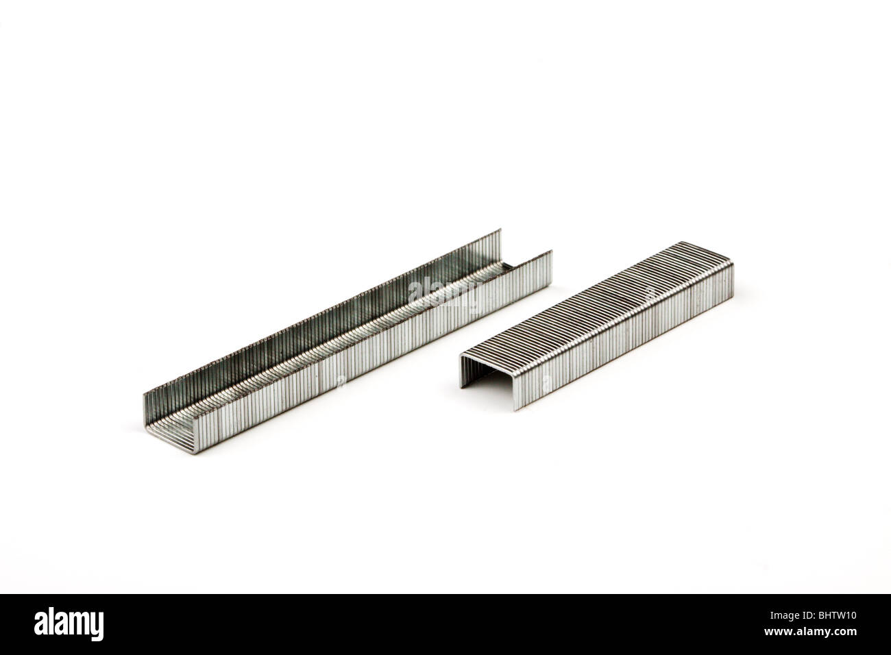 metal staples on a white background Stock Photo - Alamy