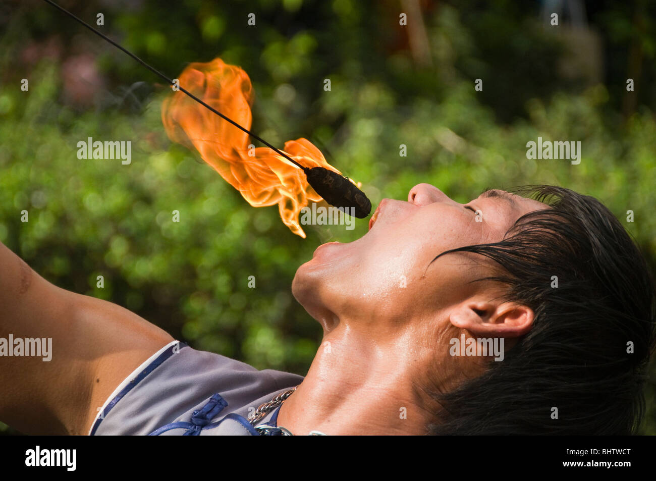 fire eater performing at the Silom Street Festival in Bangkok Thailand ...
