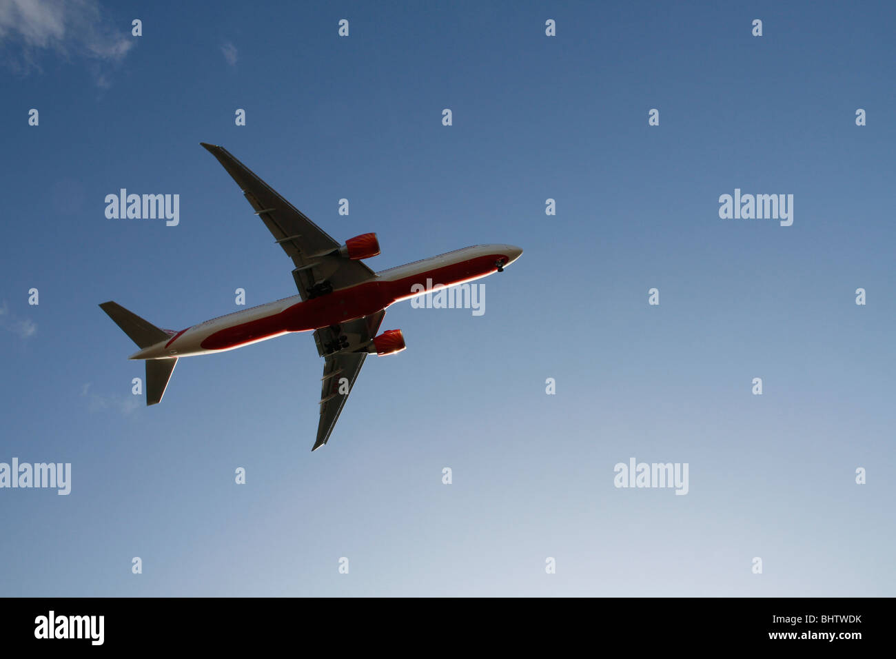 Passenger Jet passing overhead Stock Photo - Alamy