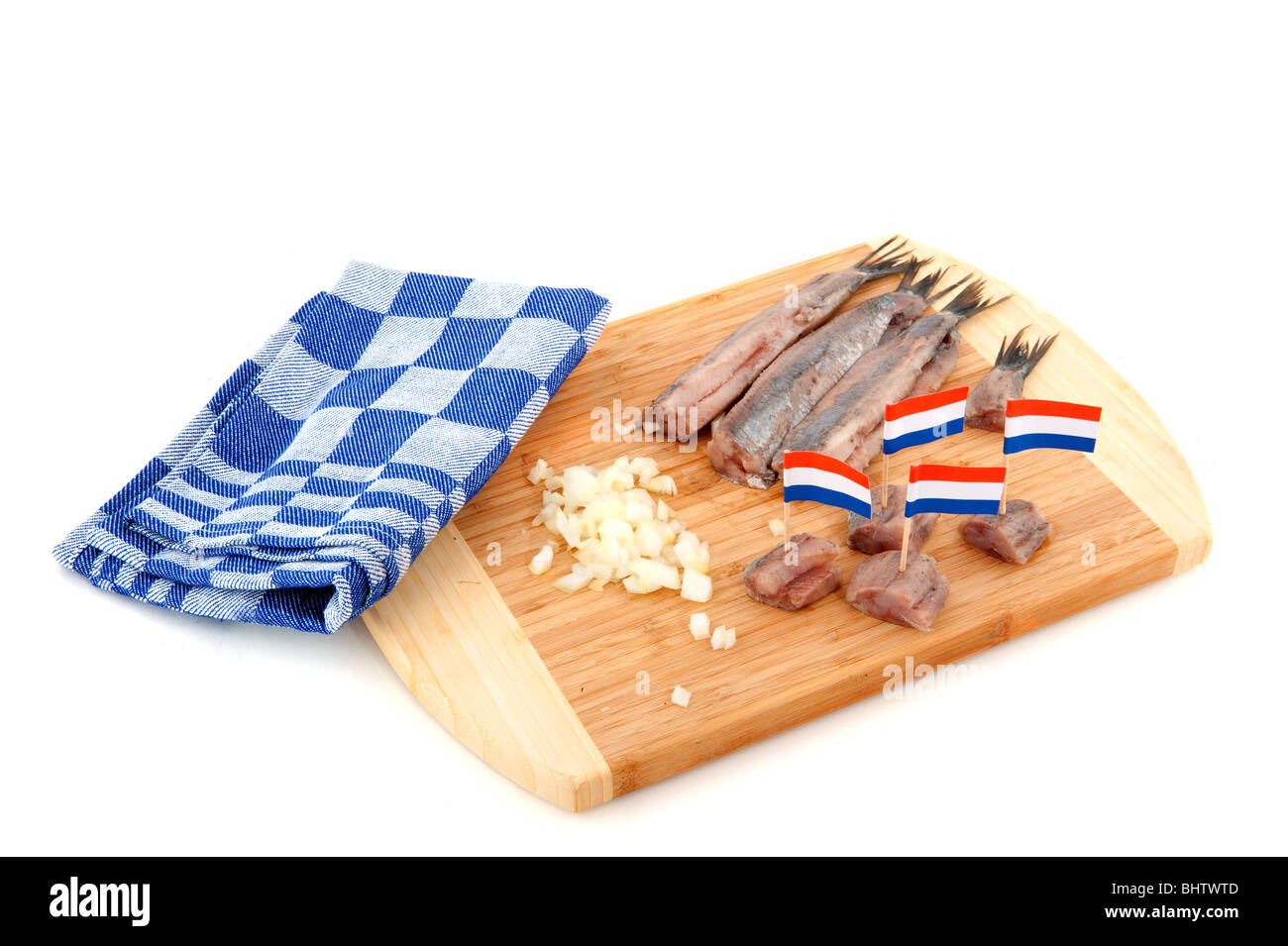 Dutch raw fish herring with flags and onions Stock Photo - Alamy