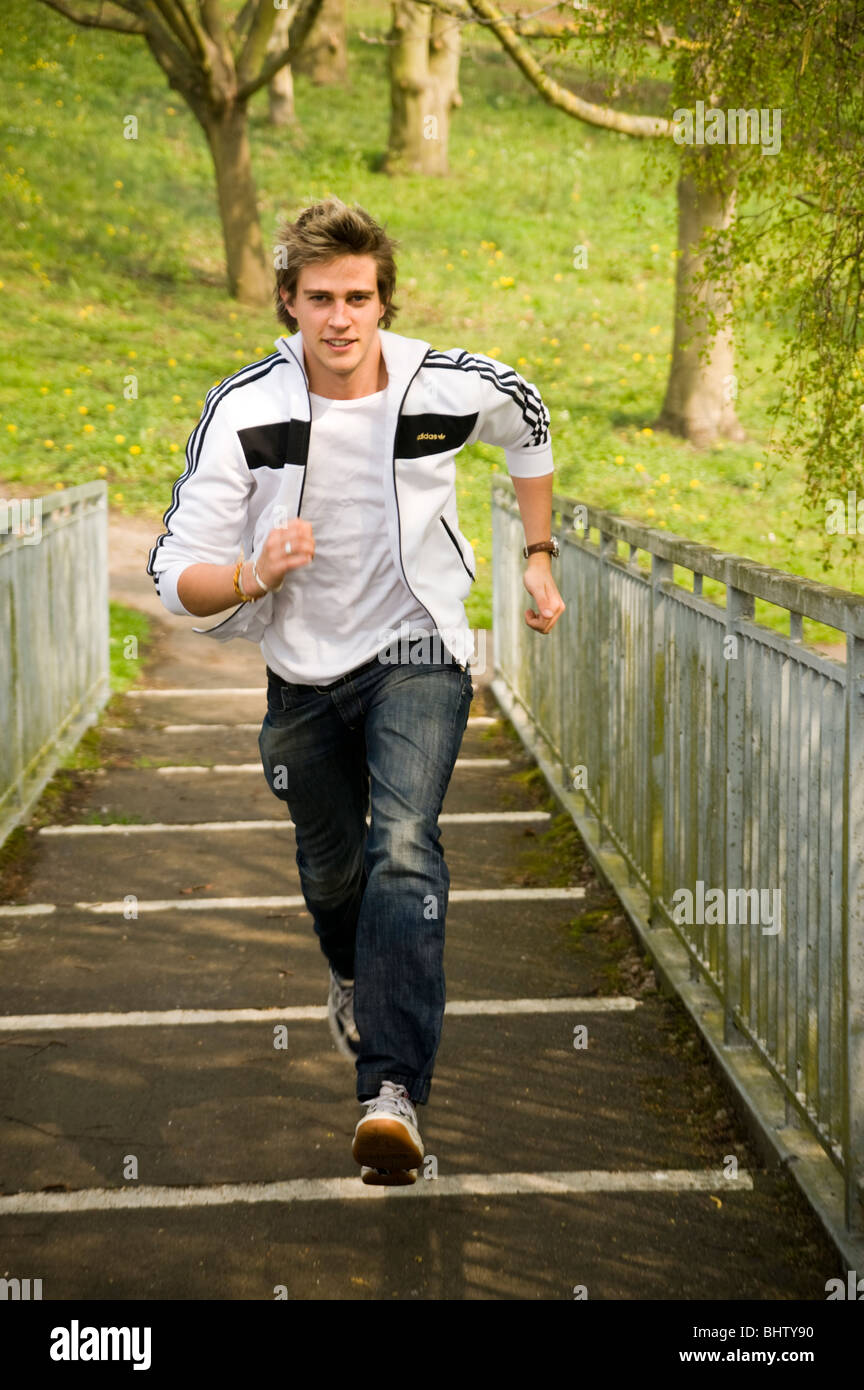 teenage boy running up some steps Stock Photo, Royalty Free Image ...