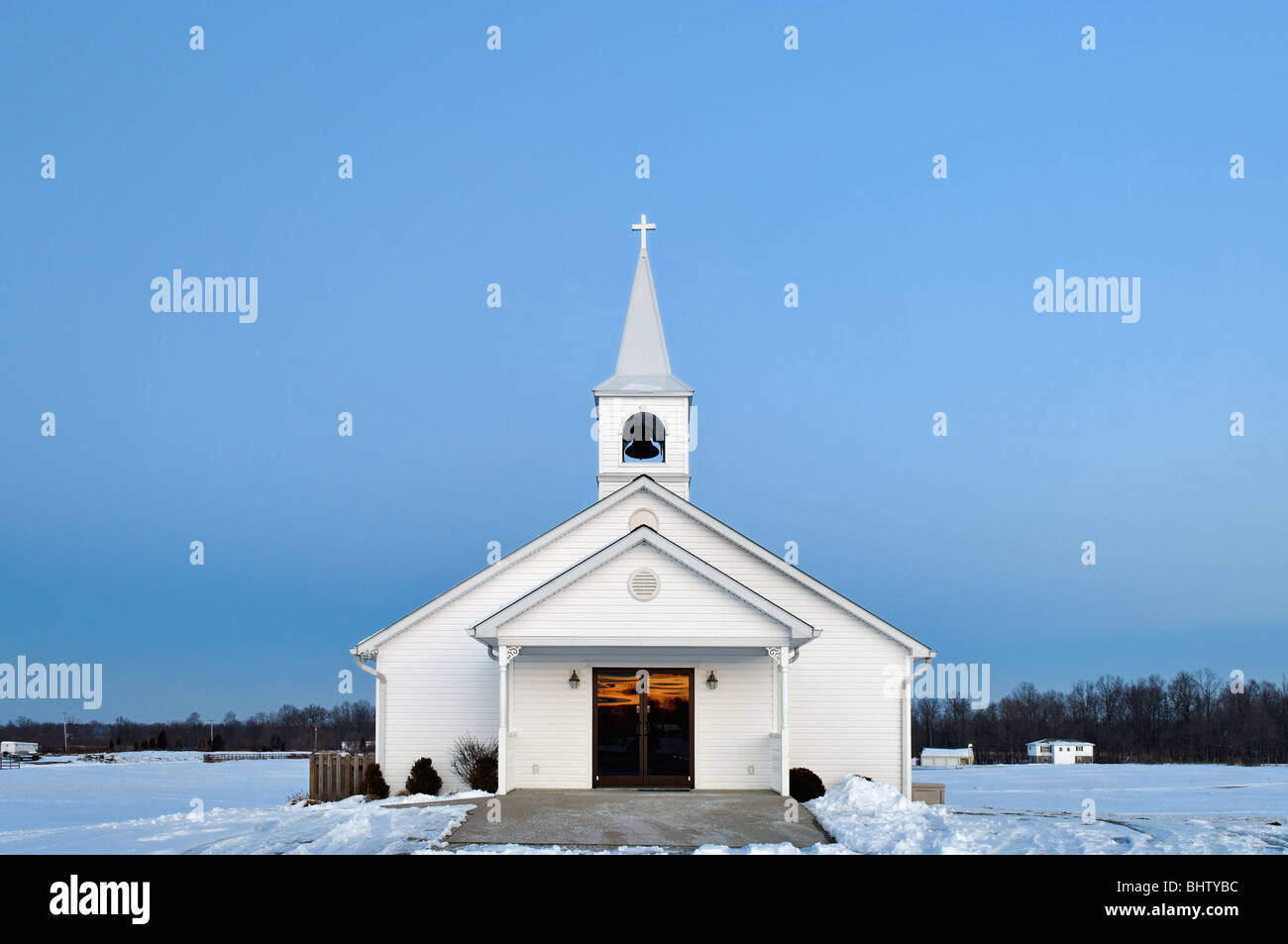 Sunset Reflected in Glass Doors of Little White Church in Crawford ...