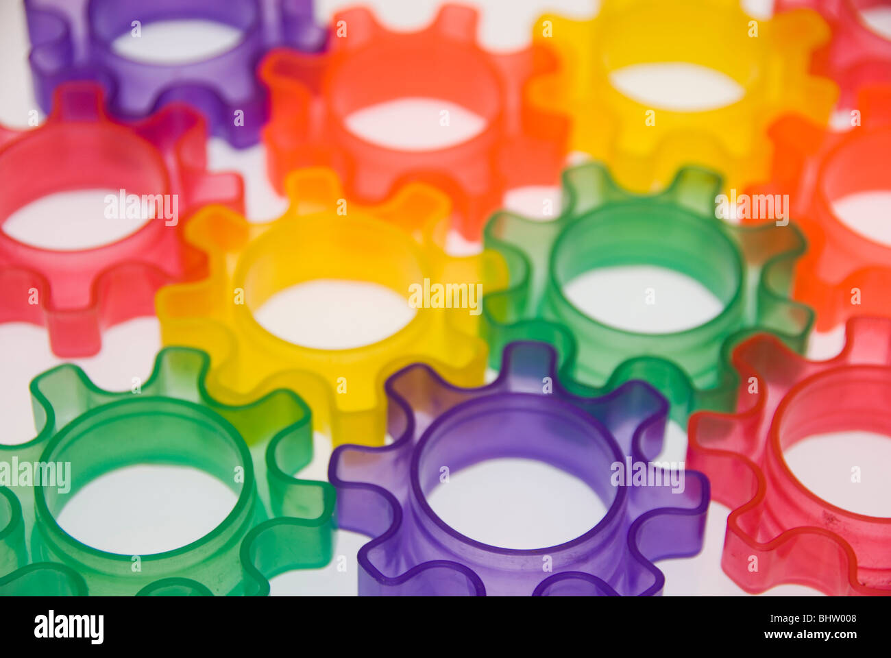 Colourful Background of Green Purple Yellow Red Orange Toy Plastic Cogs ...