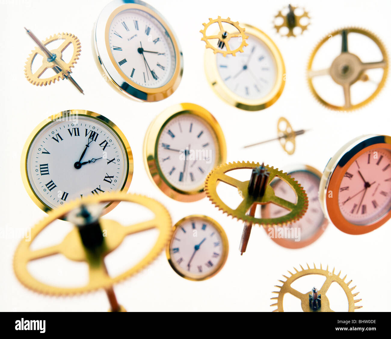 Watch mechanisms and time pieces on white background Stock Photo - Alamy