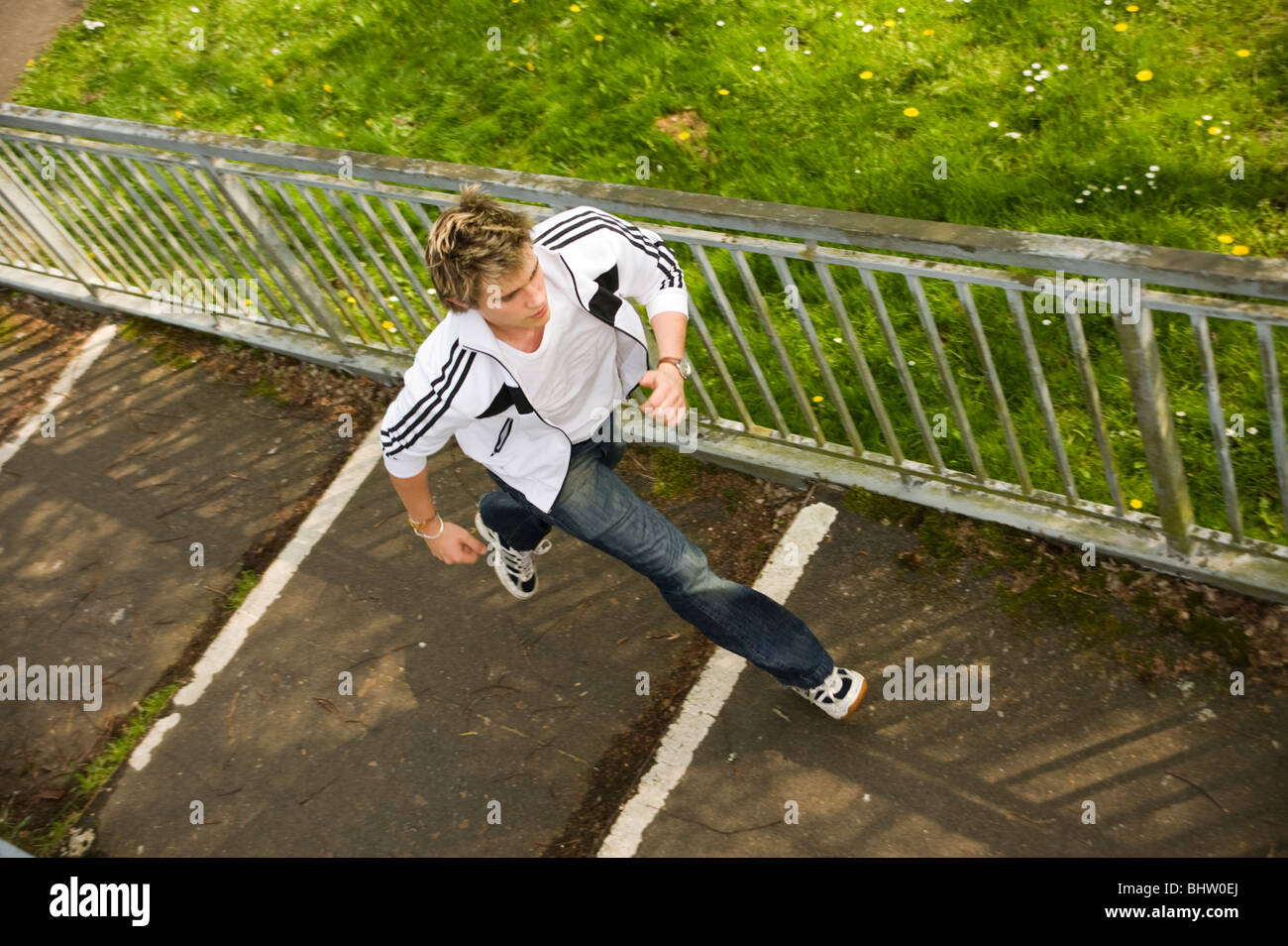 teenage boy running up some steps view from above Stock Photo - Alamy