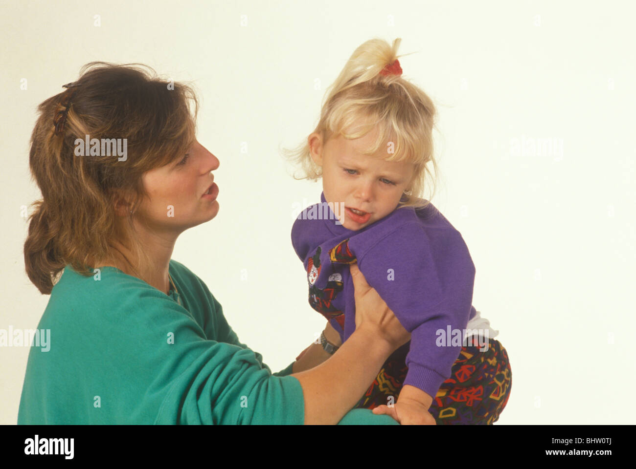 mother reasoning with her toddler daughter Stock Photo - Alamy