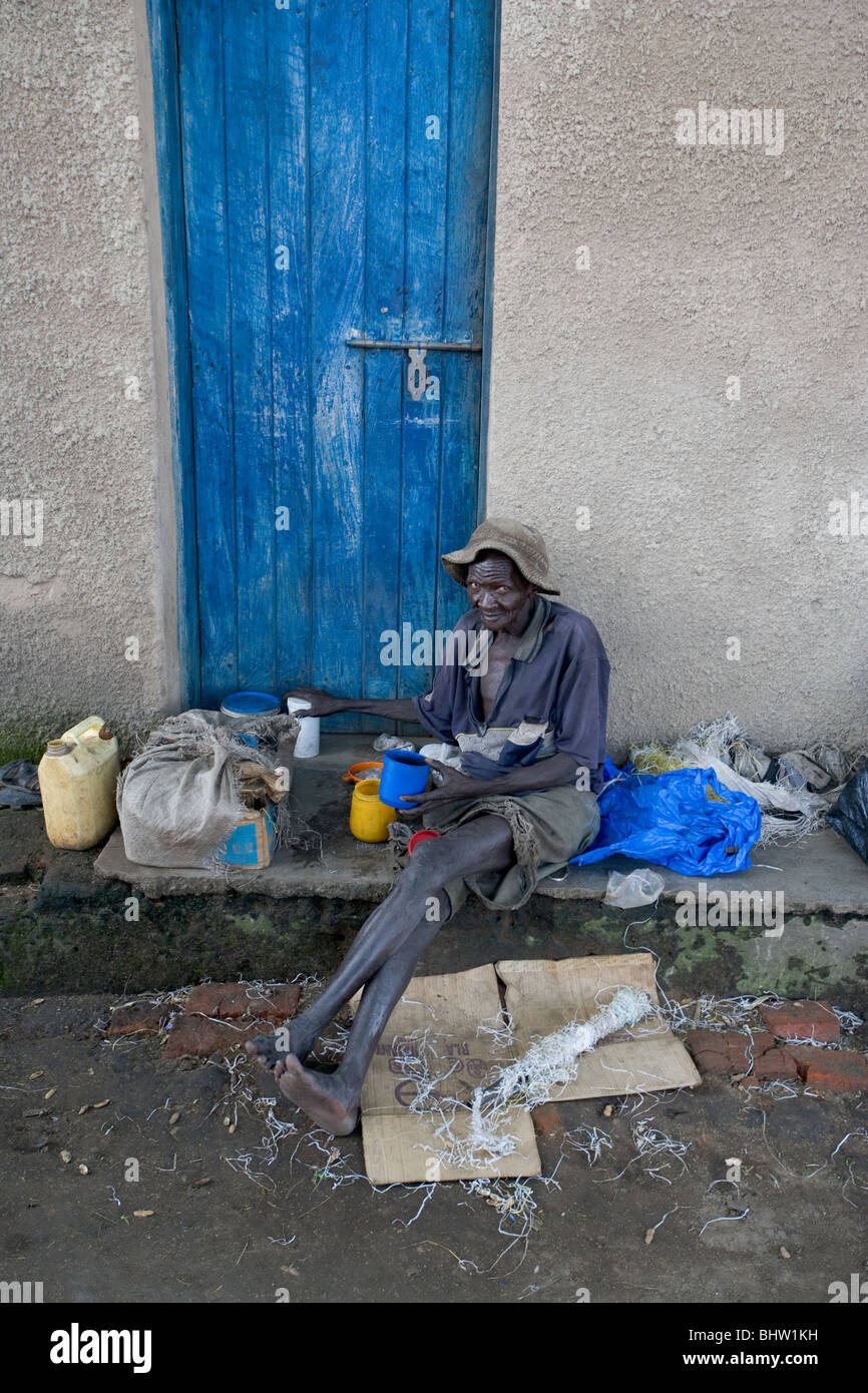 Poor elderly man with belongings in Uganda Stock Photo - Alamy