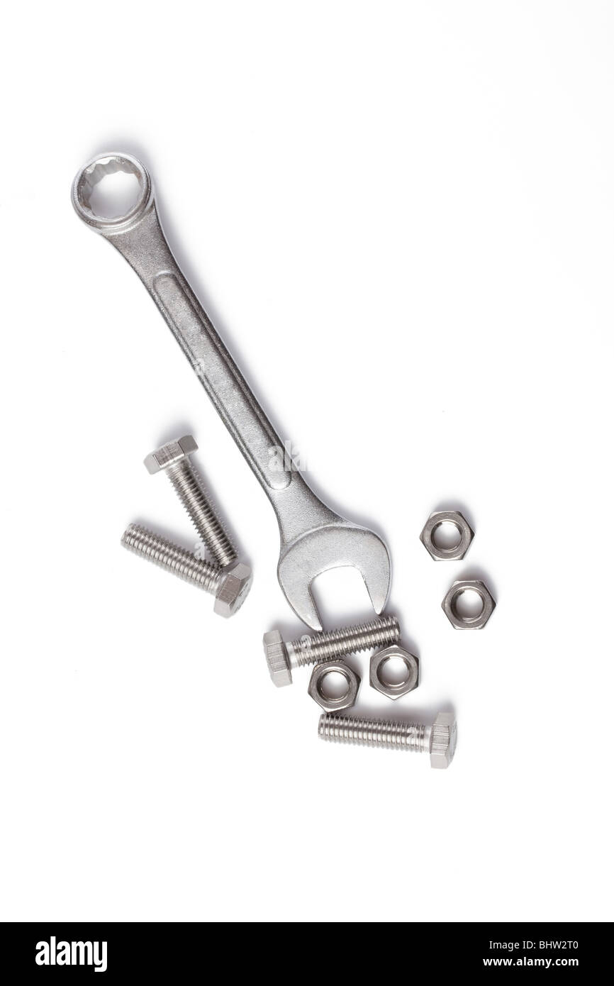 chrome spanner with nuts and bolts on white background Stock Photo - Alamy