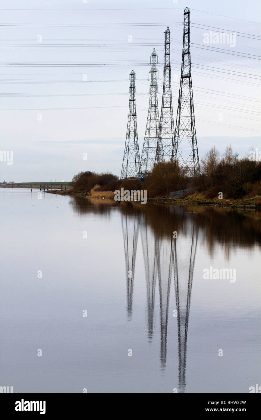 Electric pylons reflected in the River Ribble; Preston; Lancashire ...