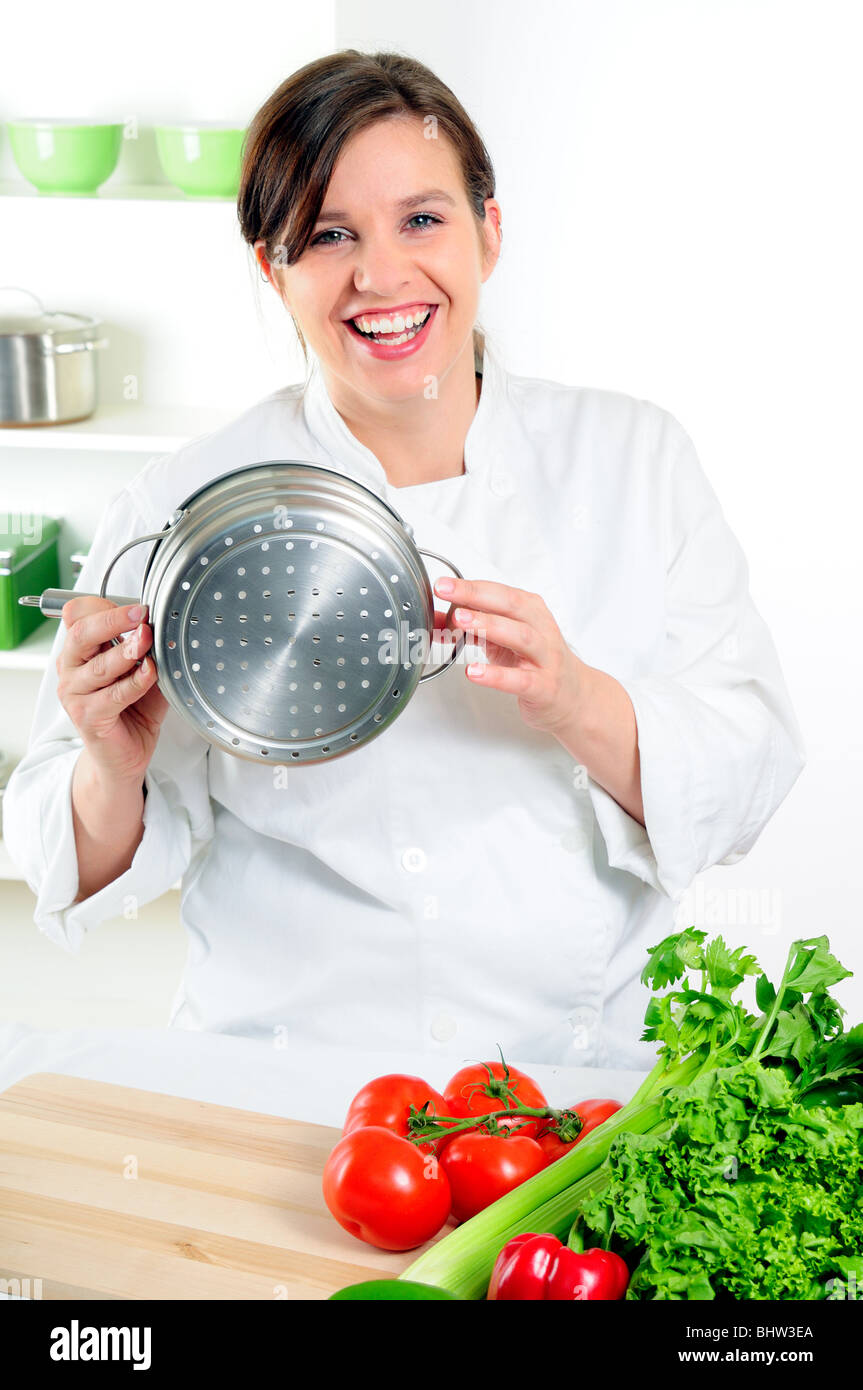 Woman Chef In Her Kitchen Stock Photo - Alamy