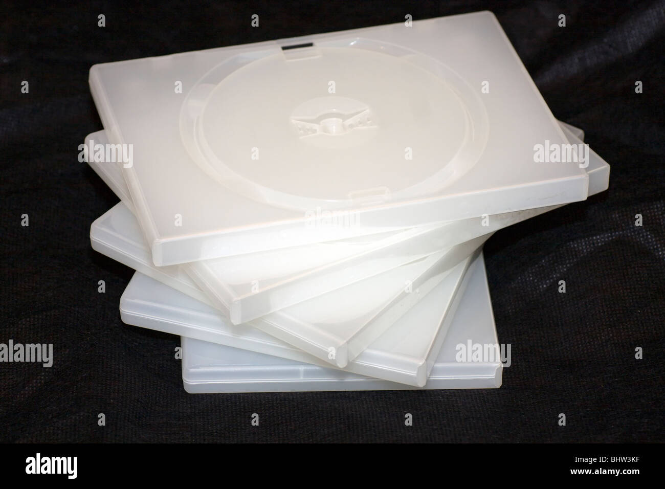 Empty, white DVD boxes isolated on black Stock Photo - Alamy