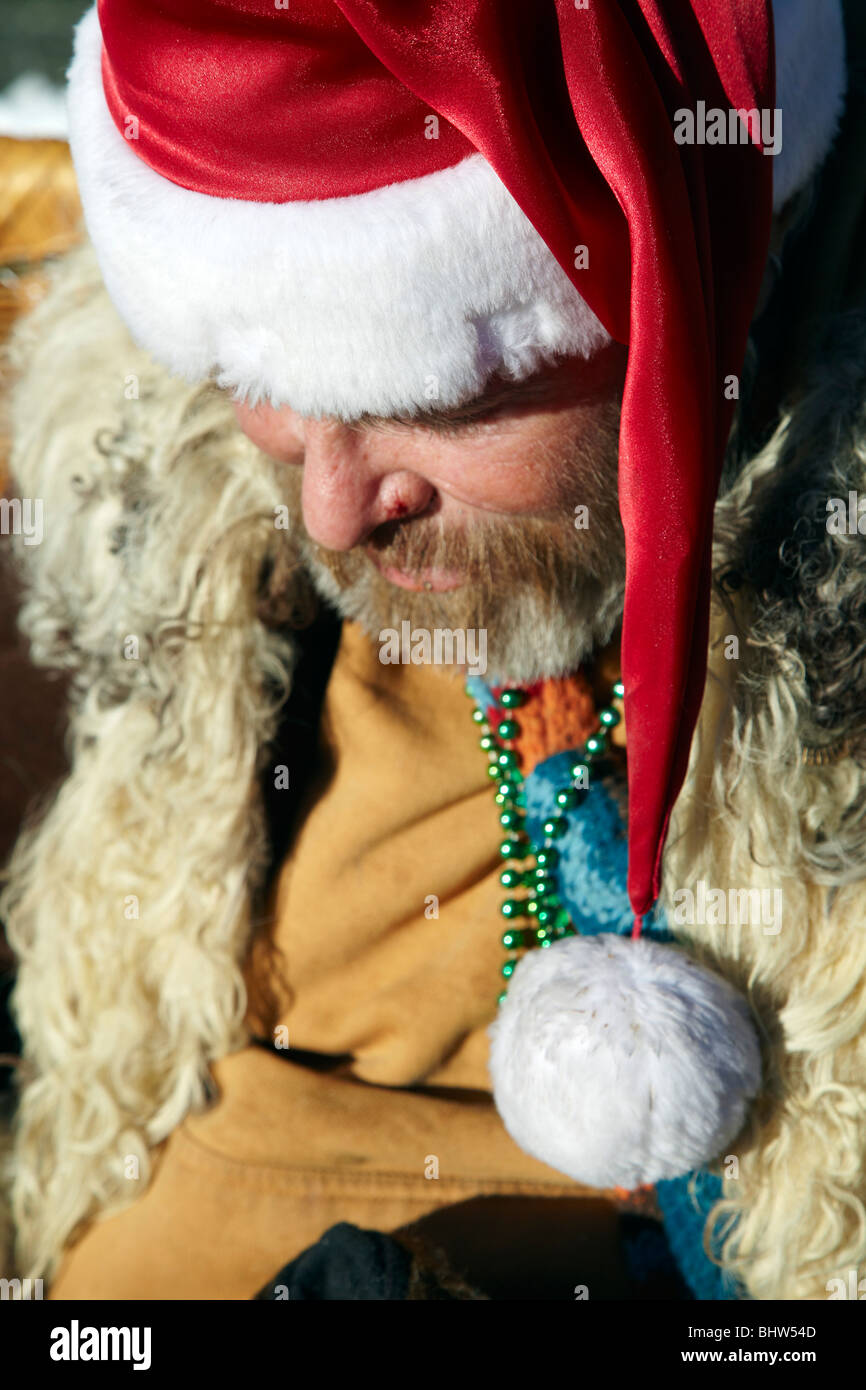 homeless man, red Santa hat homeless man Stock Photo - Alamy
