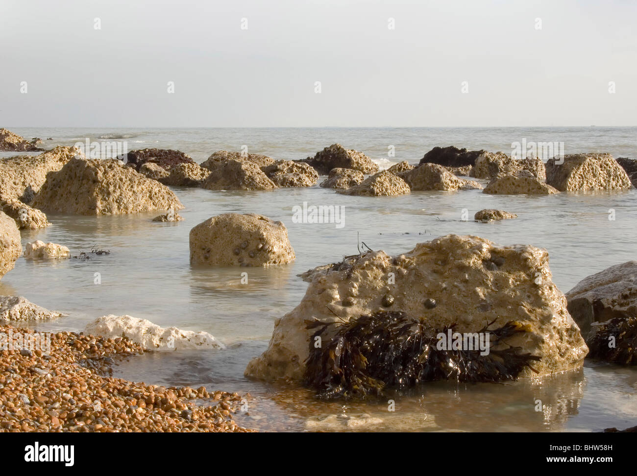 Rocks on the beach in the uk Stock Photo - Alamy