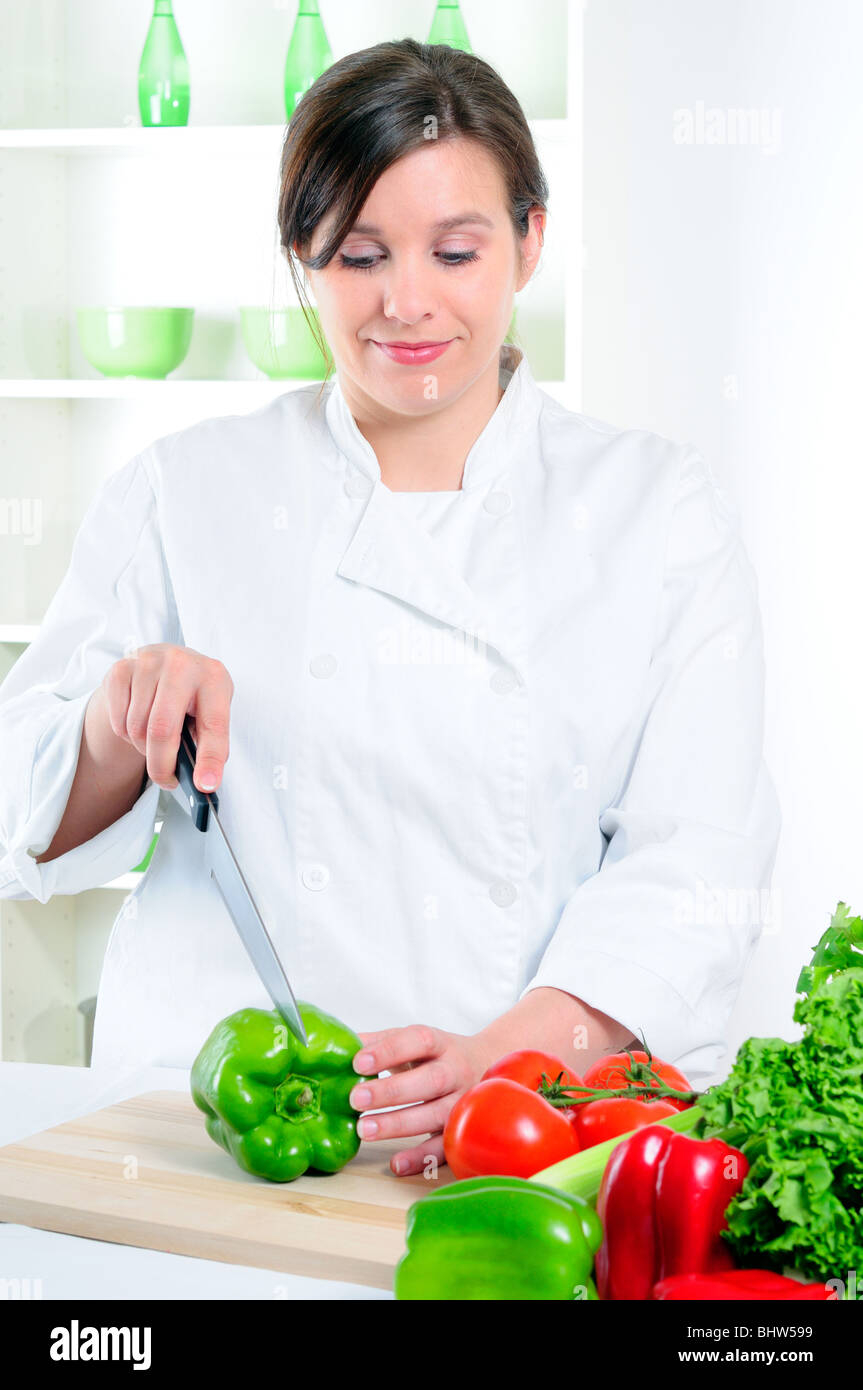 Woman Chef Inspecting A Green Pepper Stock Photo - Alamy