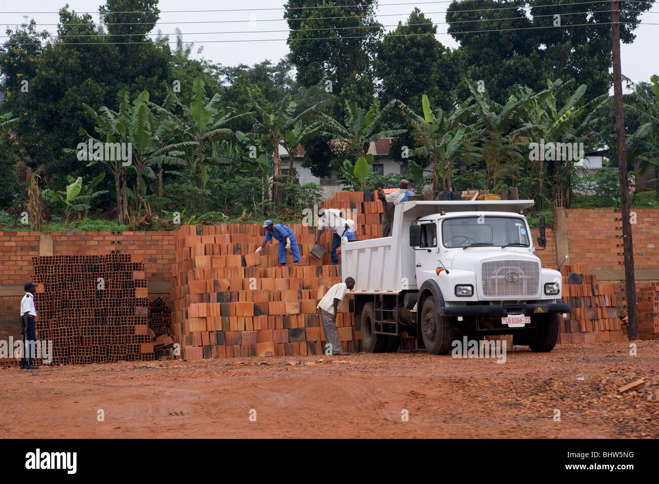 Lorry loading bricks in a builder's merchant in Kampala, Uganda Stock ...