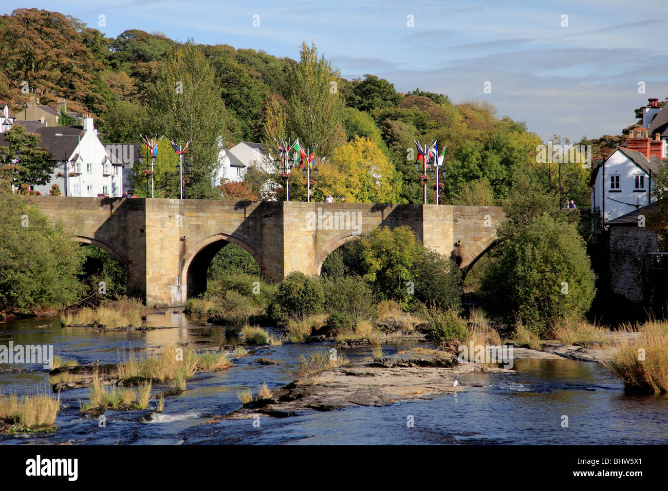 The bridge over the river Dee at Llangollen, Wales with the flags of ...