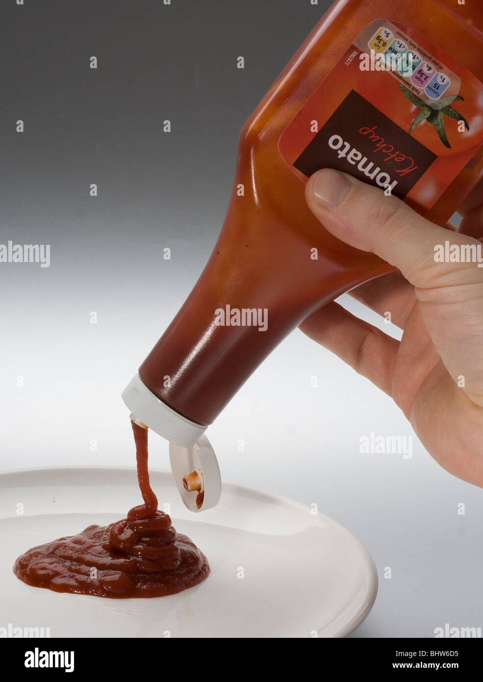 Tomato ketchup being squeezed out Stock Photo - Alamy