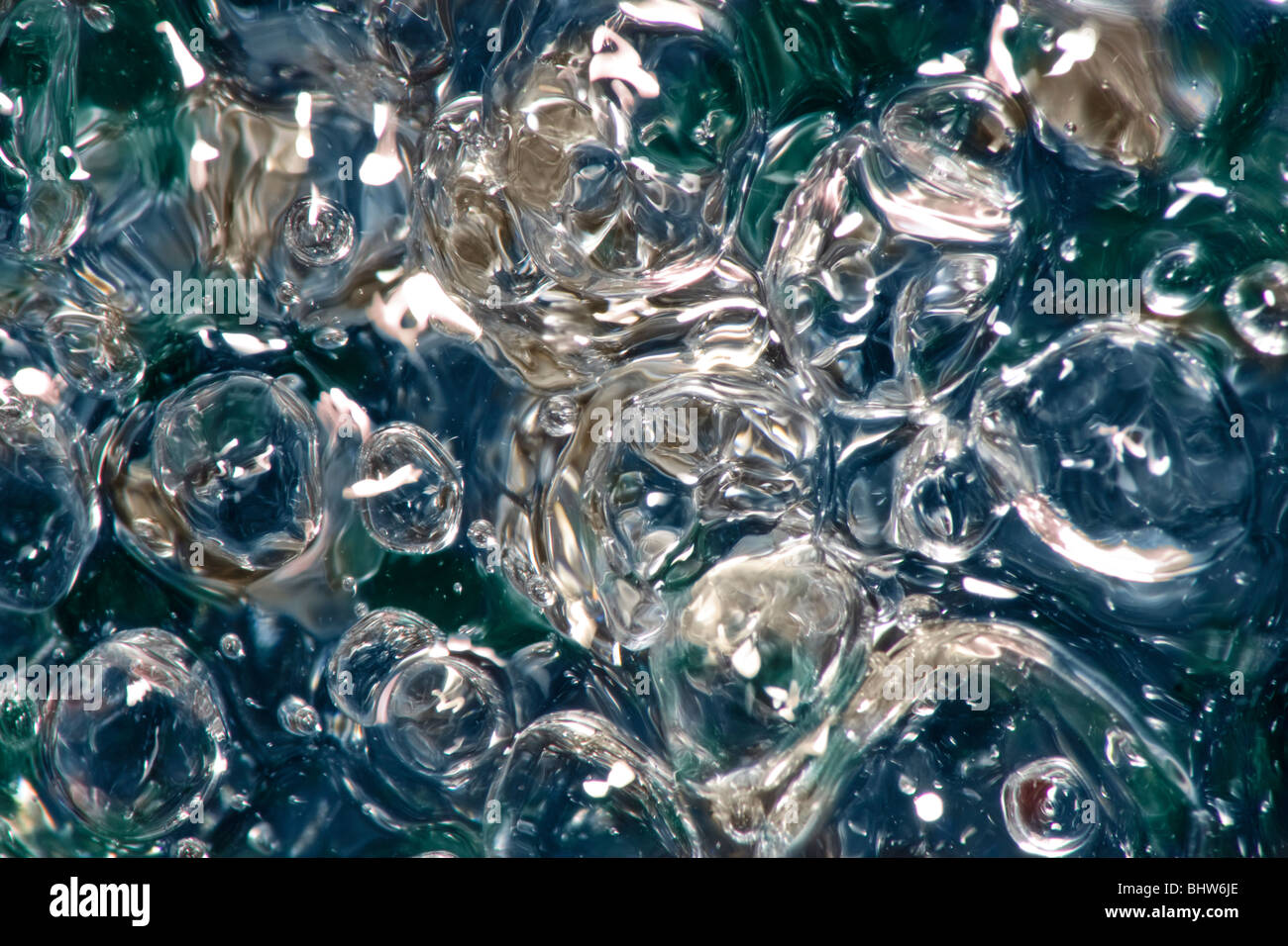 Bubbles floating through water, closeup abstract Stock Photo - Alamy