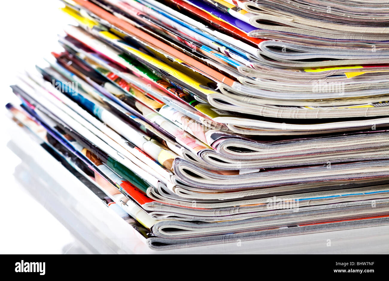Magazines stack isolated on white background Stock Photo - Alamy