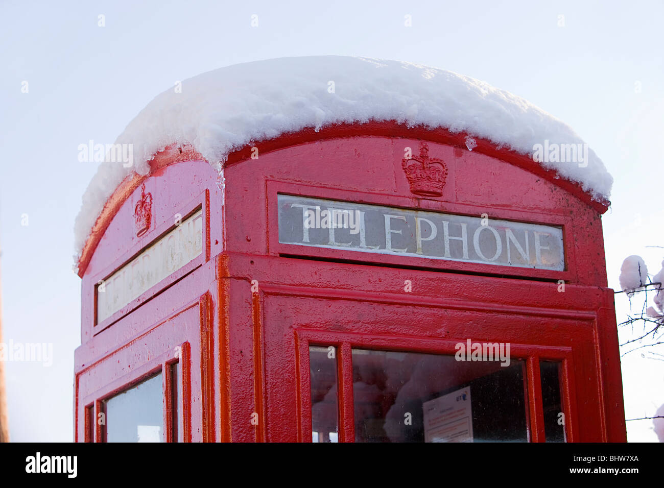 red telephone box covered in snow Stock Photo - Alamy