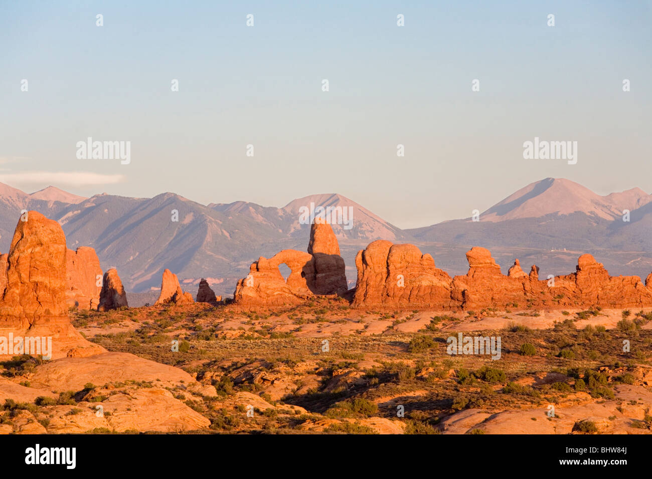 A sunset view of the South Window Natural Arch in Arches National Park ...