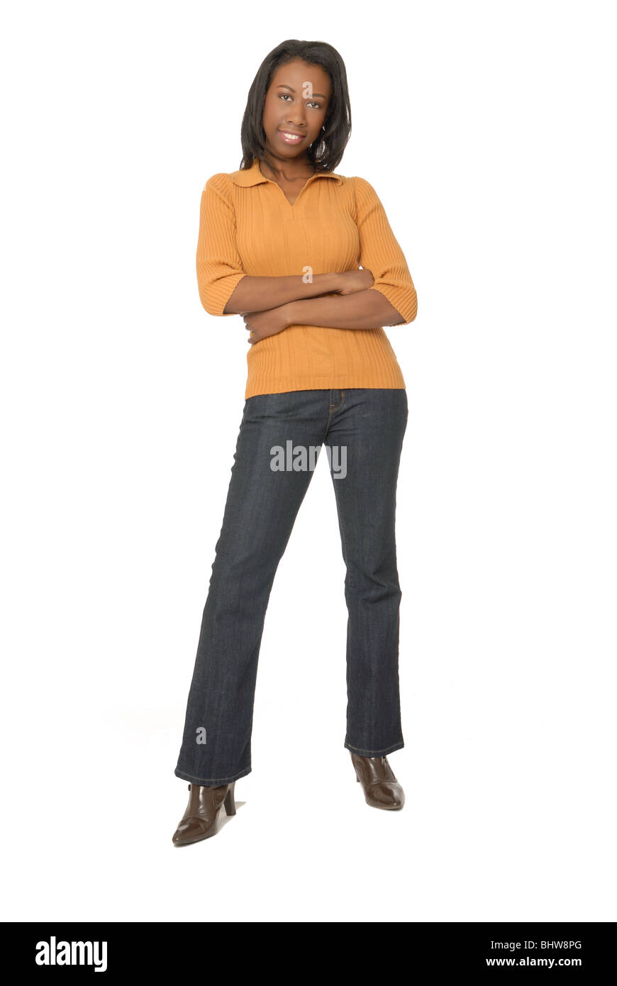 Attractive woman standing, on white background, smiling with arms ...